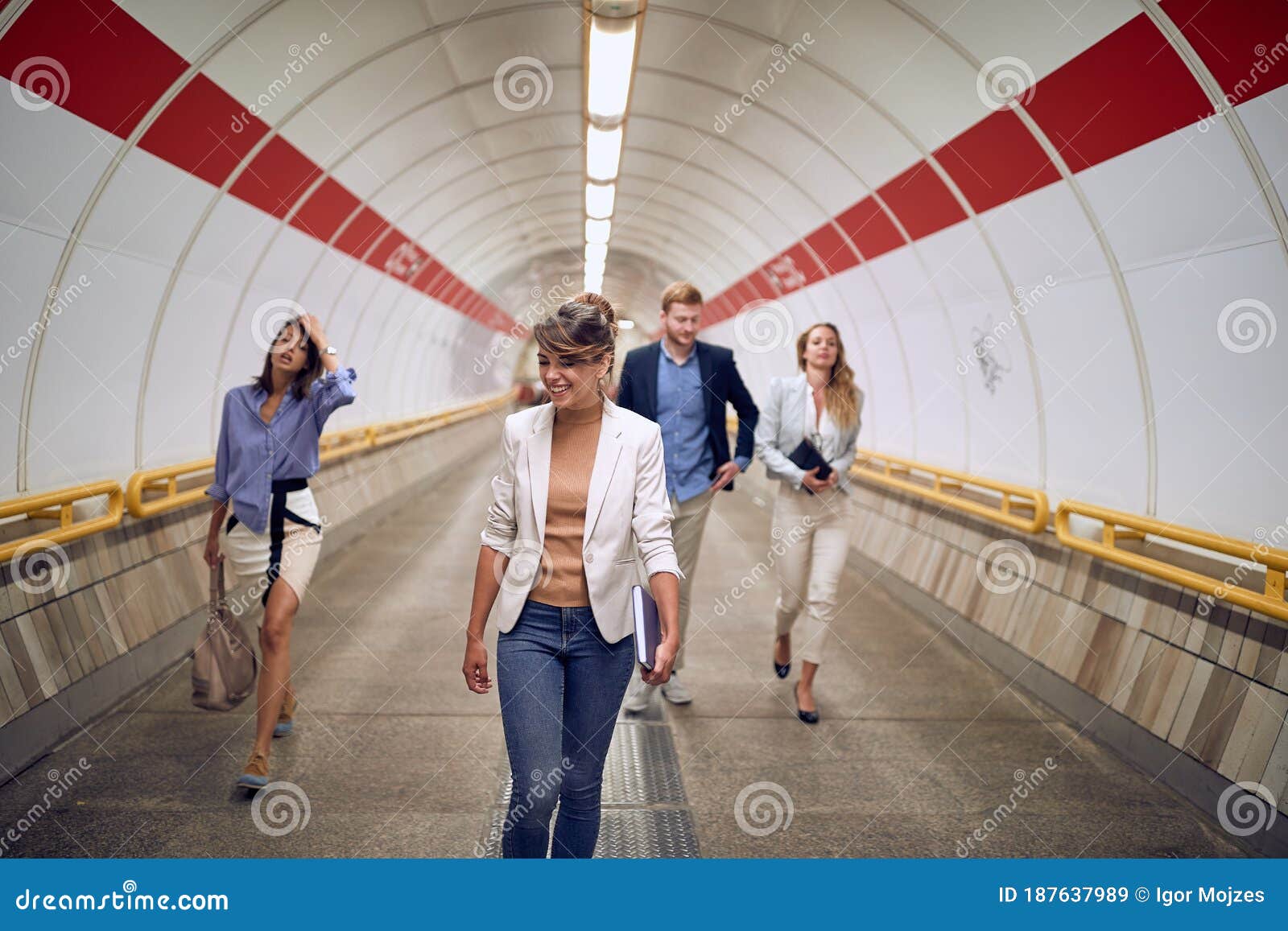 Group of Young People Walking through Pedestrian Subway Stock Image ...