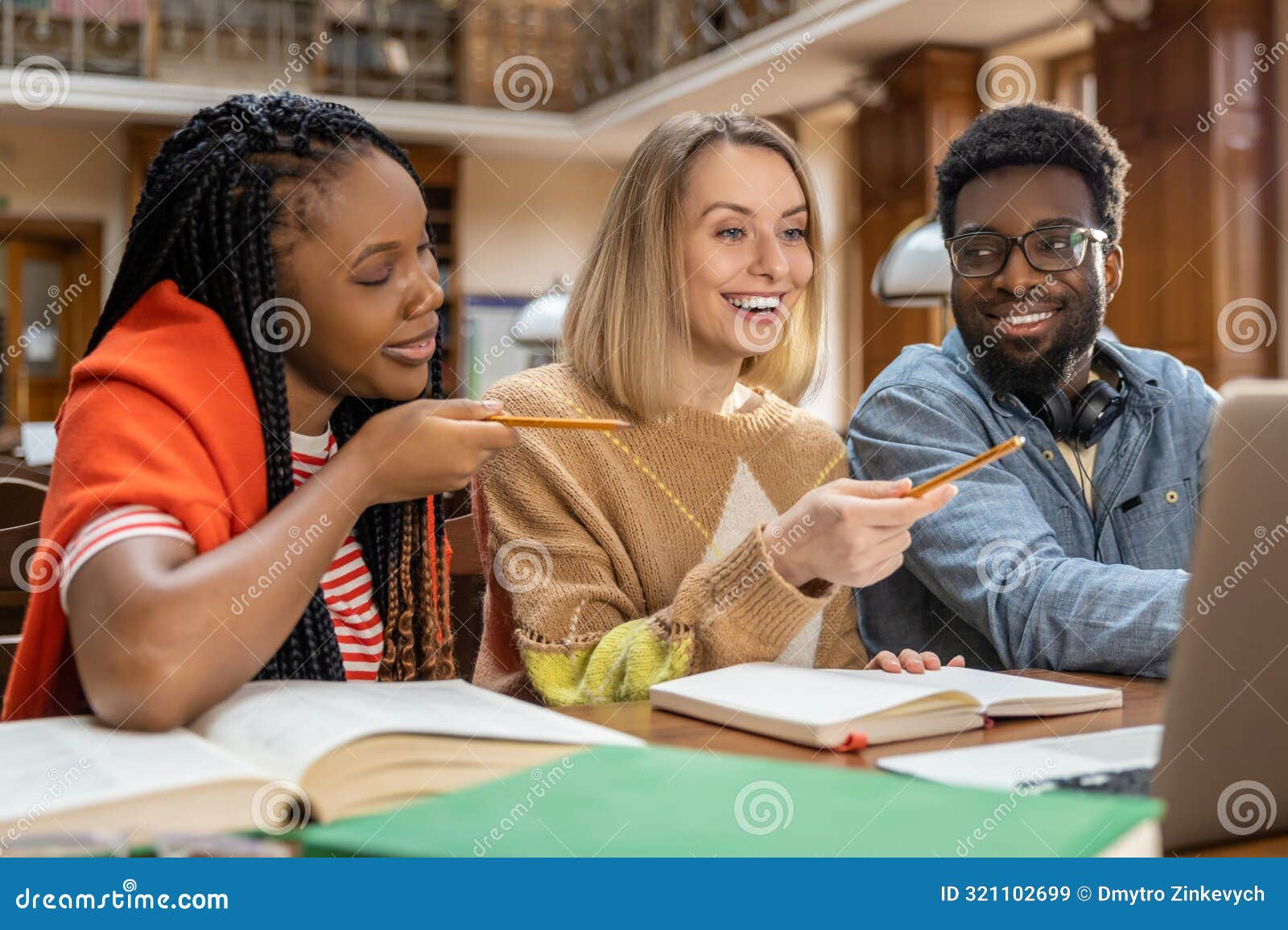 Group of Young People Working on the Project Together and Looking ...