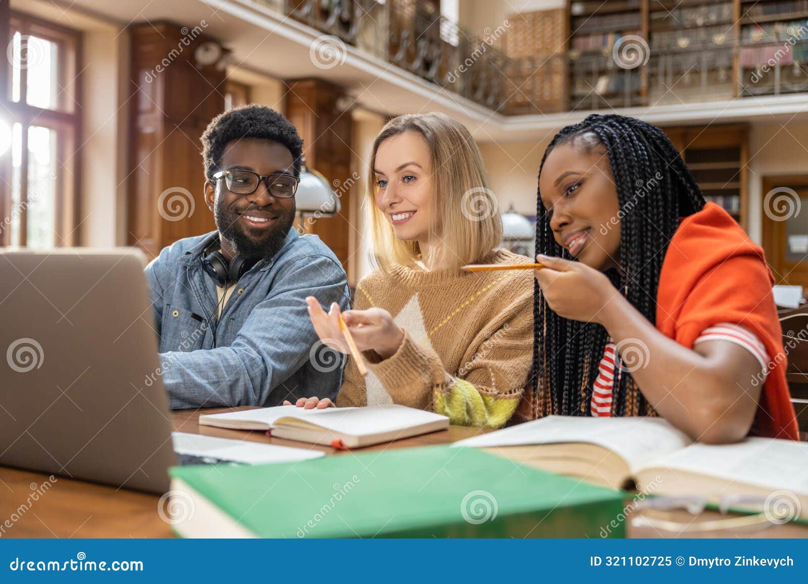 Group of Young People Working on the Project Together and Looking ...