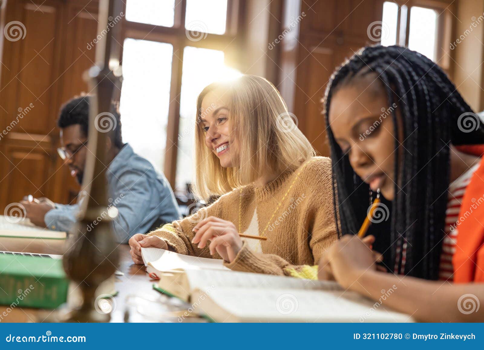 Group of Young People Working on the Project Together and Looking ...
