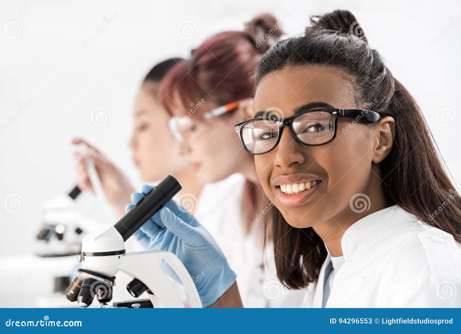 Group of Young Professional Scientists Working with Microscopes in ...