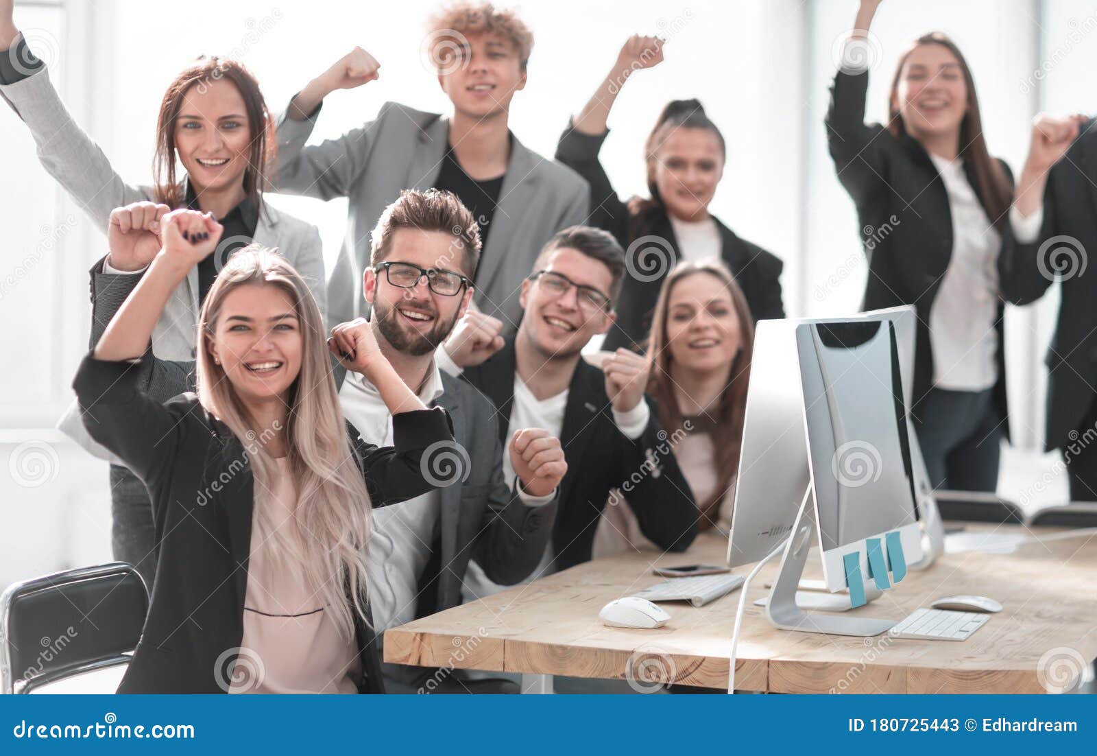 Group of Young Professionals Sitting at an Office Desk. Stock Image ...