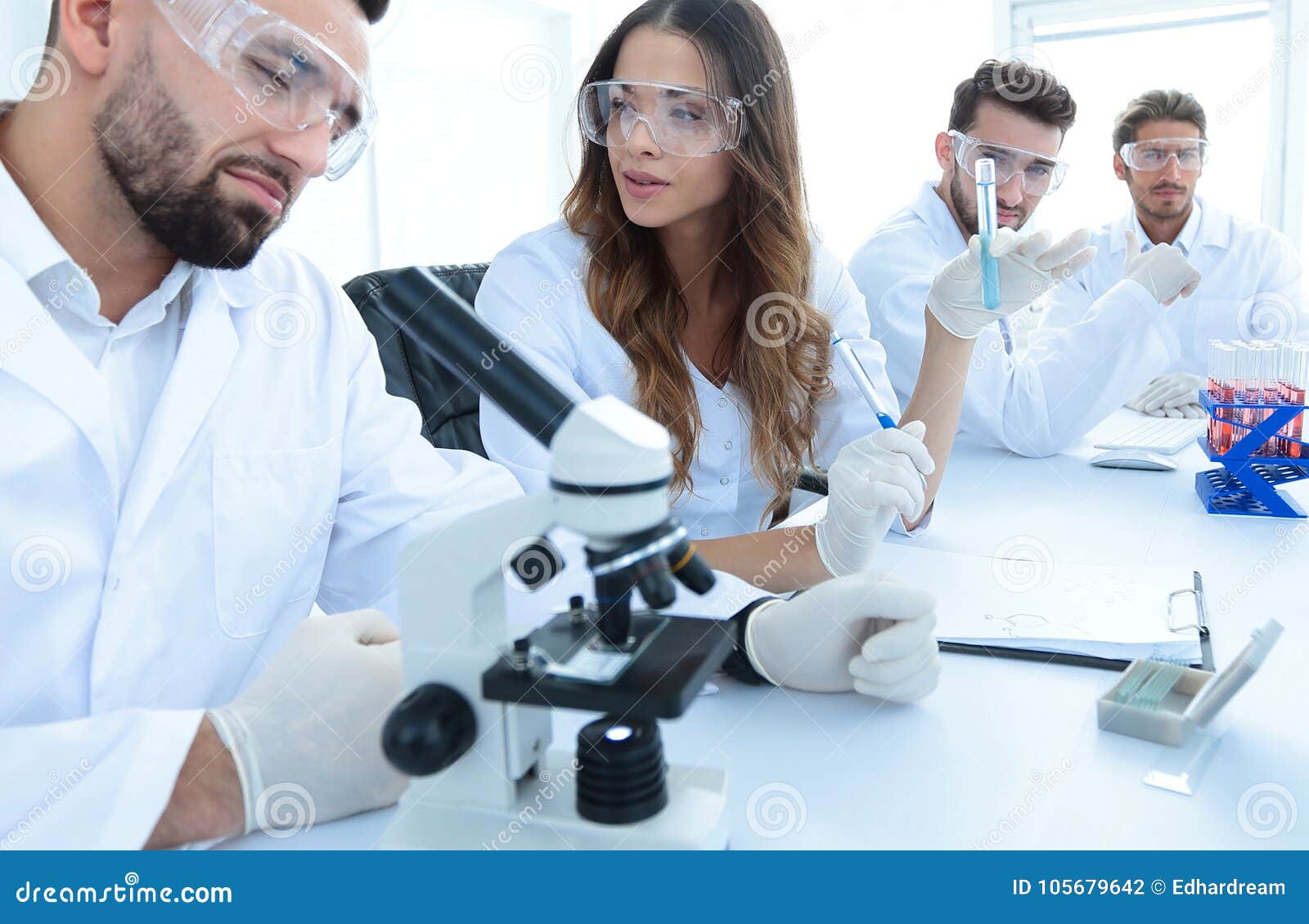 Group of Young Scientists Discussing the Results of a Study Stock Photo ...