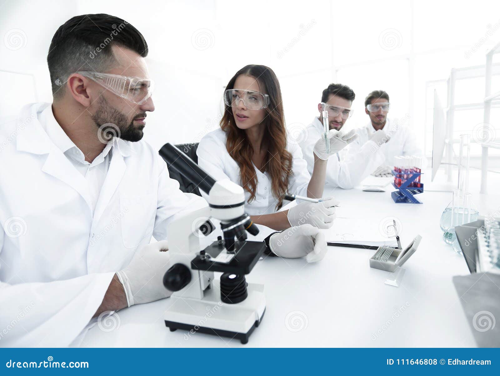 Group of Young Scientists Discussing the Results of a Study Stock Photo ...