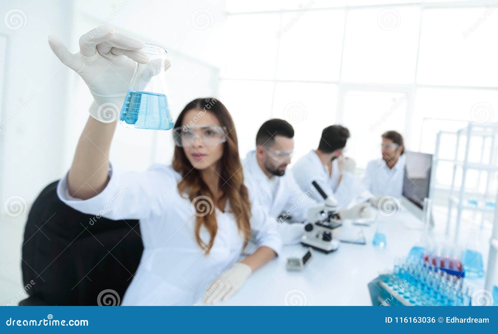 Group of Young Scientists Working in the Laboratory. Stock Photo ... Group of Young Scientists Working in the Laboratory. Stock Photo ...