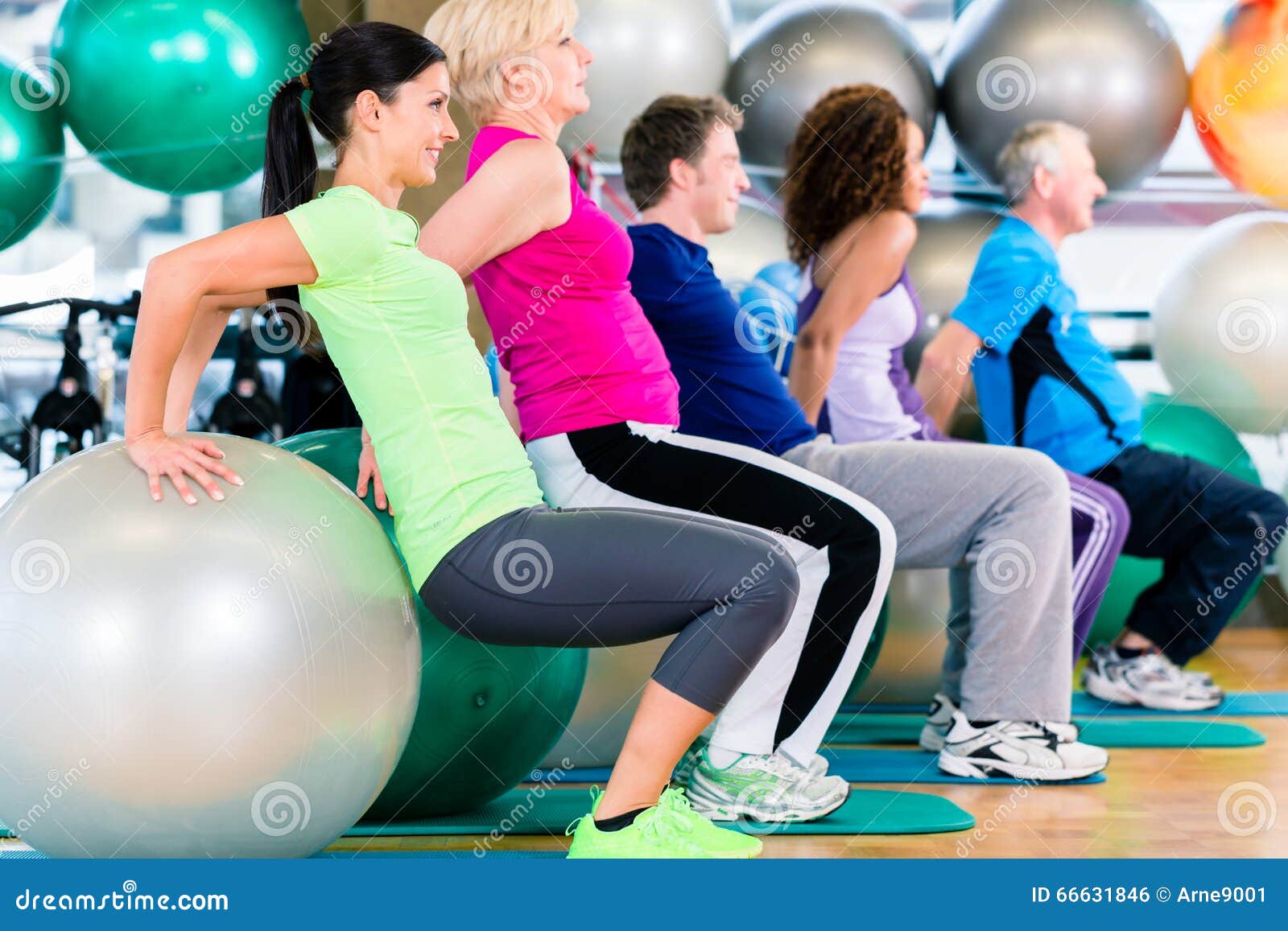 Group of Young and Senior People Exercising in Gym Stock Photo - Image ...