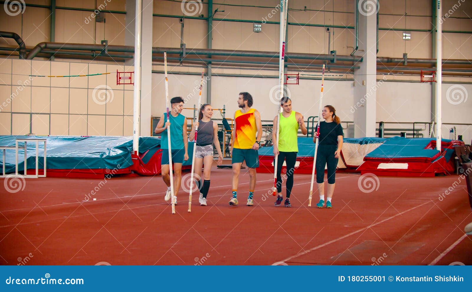 Group of Young Smiling People on the Pole Vault Training Walking on the ...