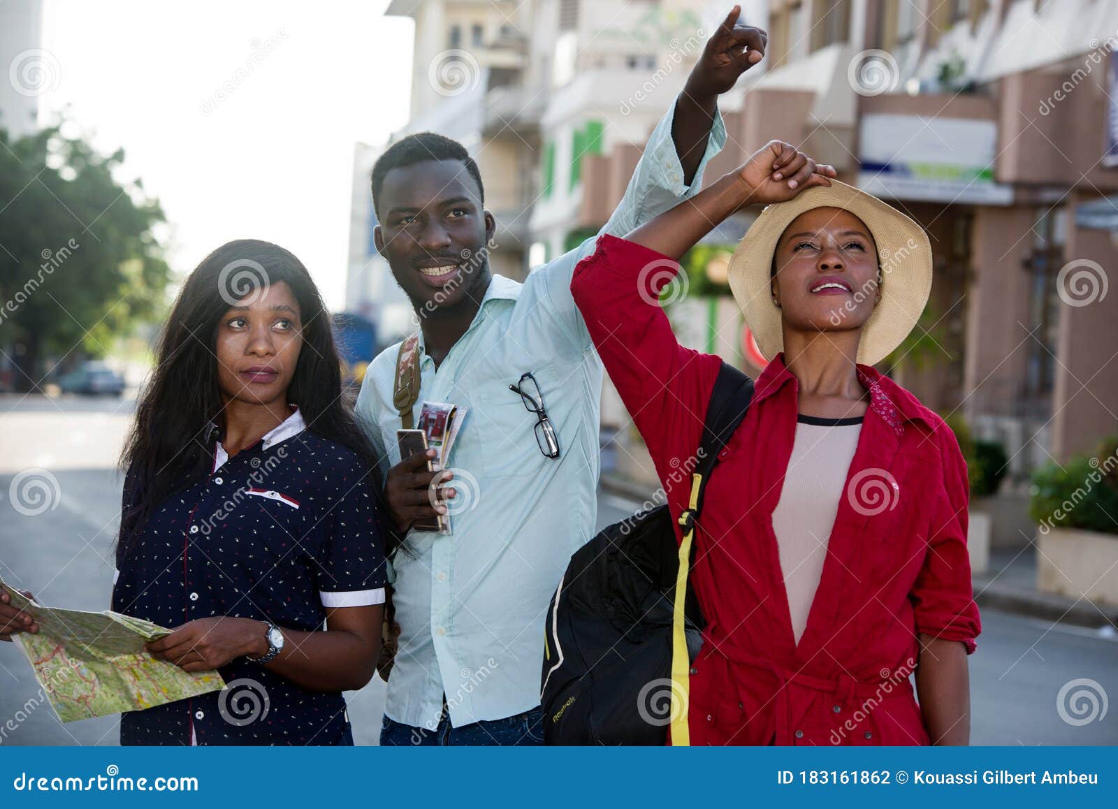 Group of Young Smiling Tourists Stock Photo - Image of african, mobile ...