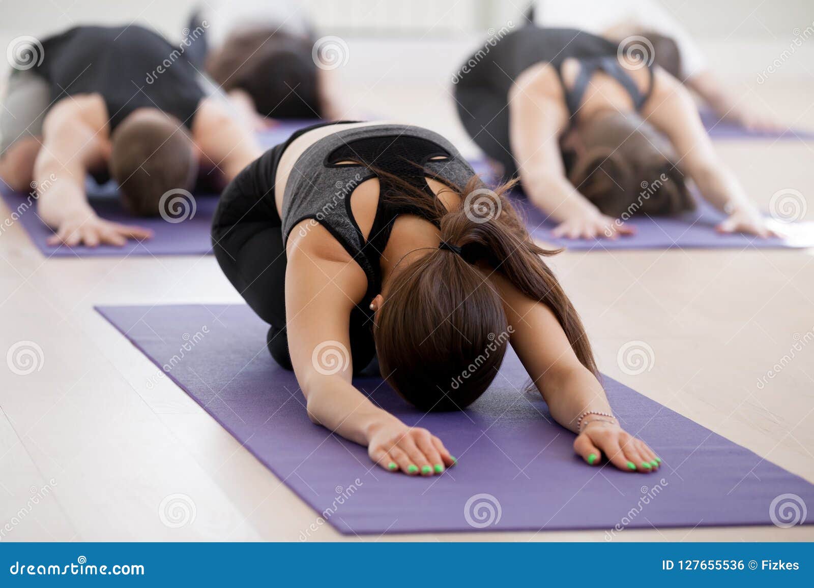 Group of Young Sporty People Practicing Yoga Lesson, Child Exerc Stock ... Group of Young Sporty People Practicing Yoga Lesson, Child Exerc Stock ...