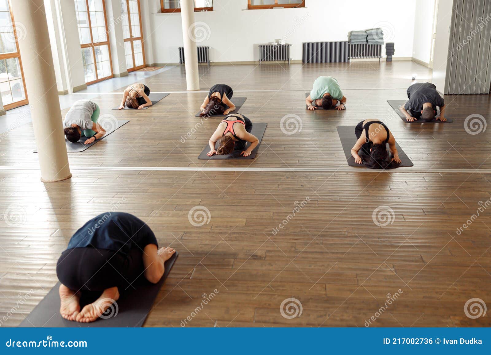 Group of Young Sporty People Practicing Yoga Lesson with Instructor, Do ...