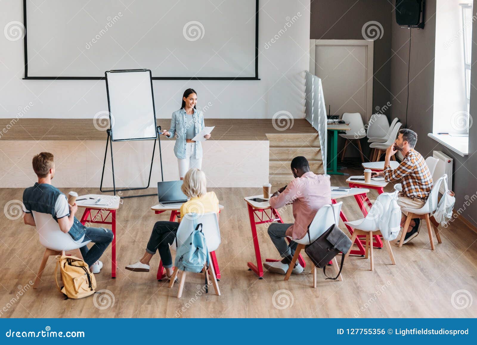 Group of Young Students Sitting in Class and Listening Stock Photo ...