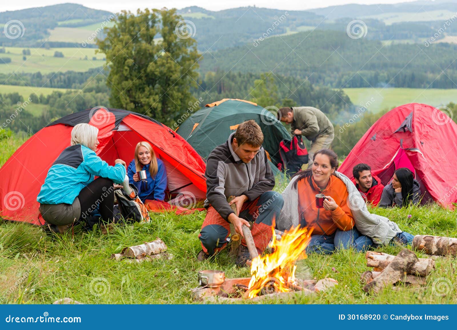 Sitting by Campfire Friends in Tents Chatting Stock Photo - Image of ...