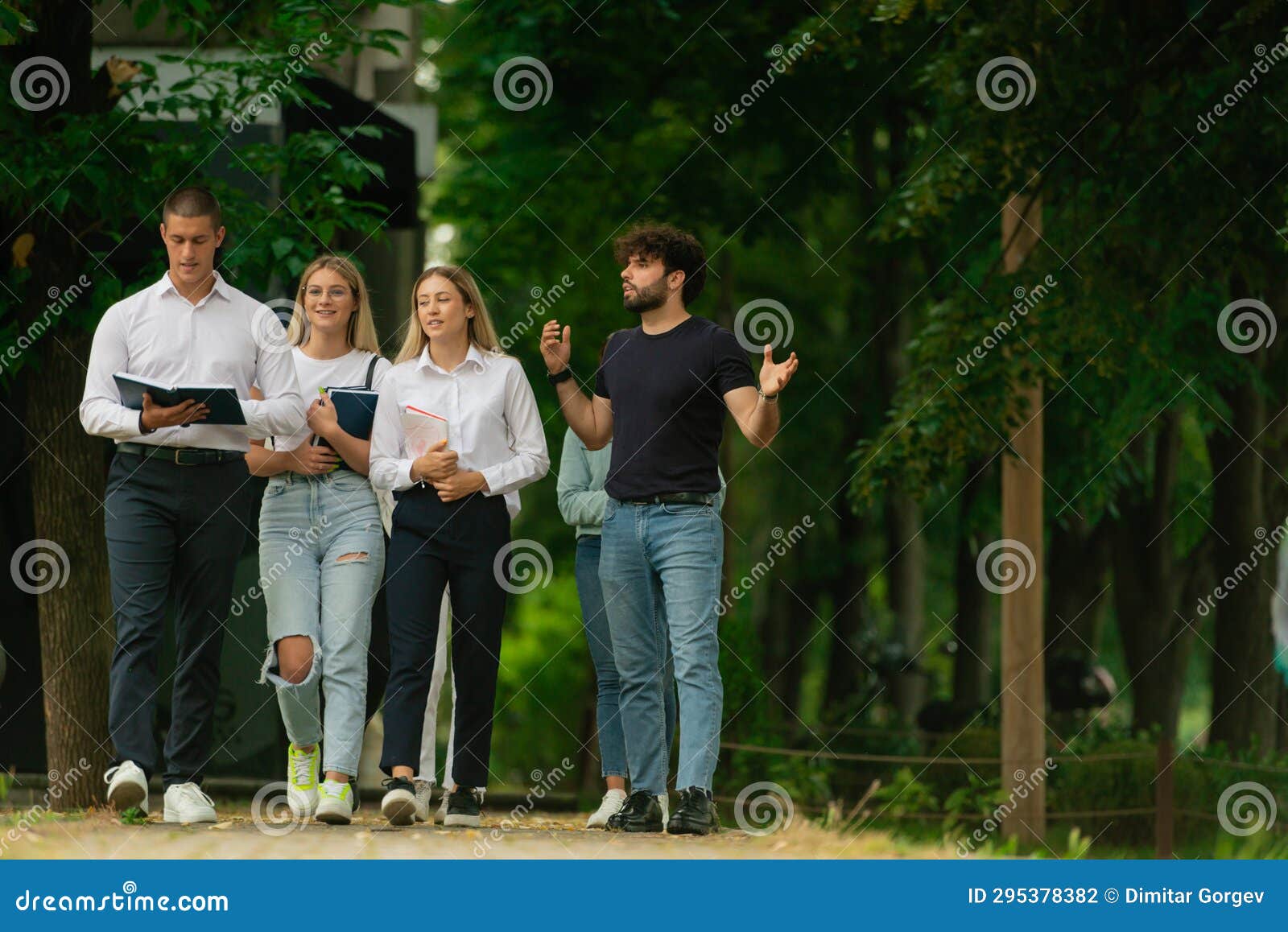 Group of Young Students Walking Together Outside Stock Photo - Image of ...