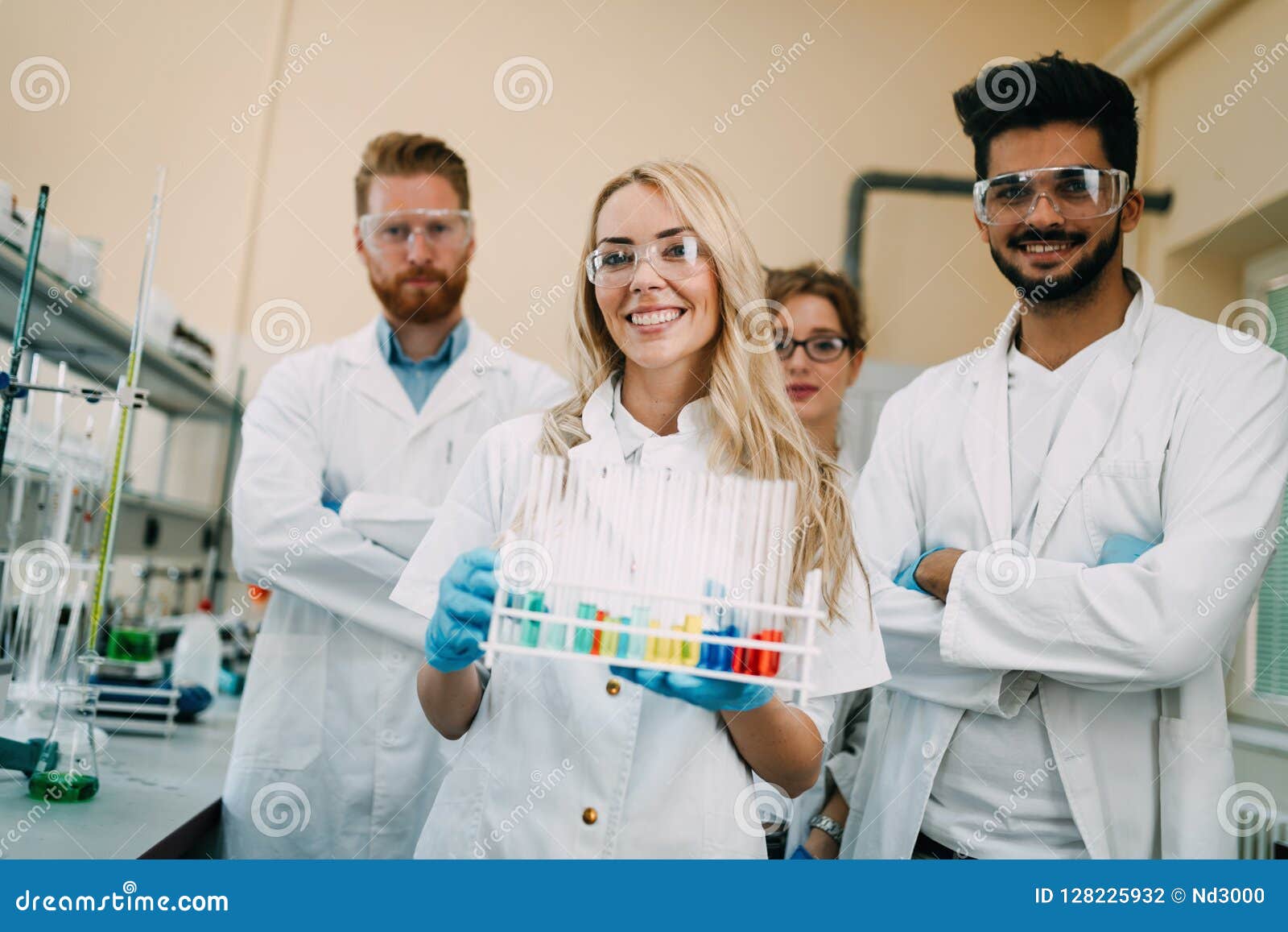 Group of Young Successful Scientists Posing for Camera Stock Photo ...