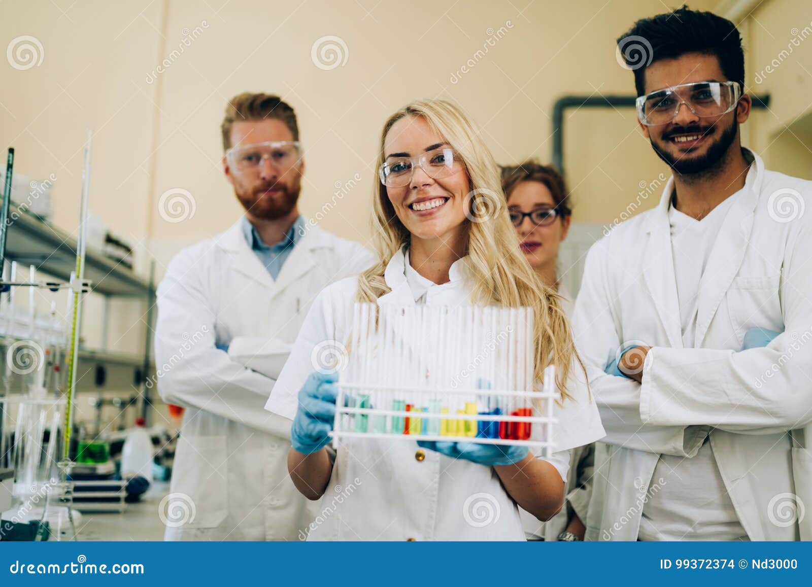 Group of Young Successful Scientists Posing for Camera Stock Photo ...