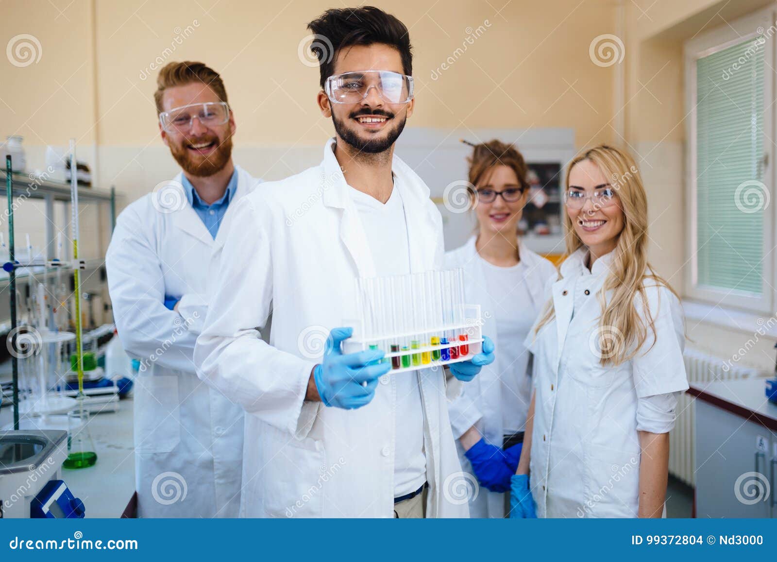 Group of Young Successful Scientists Posing for Camera Stock Photo ...