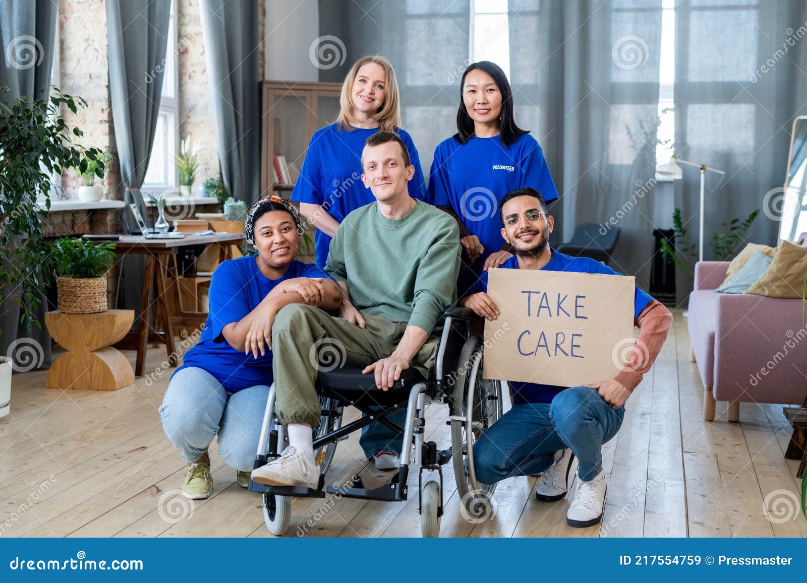 A Group of Young Volunteers and Disable Guy Stock Image - Image of ...