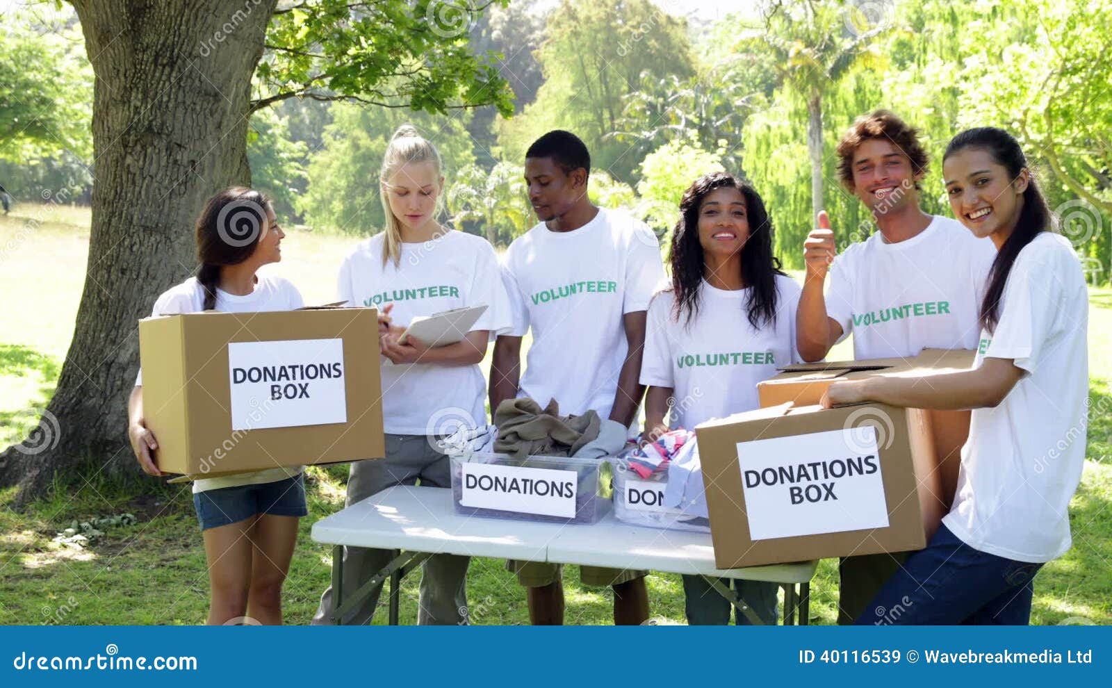 Group of Young Volunteers Sorting Donation Boxes Stock Video - Video of ...
