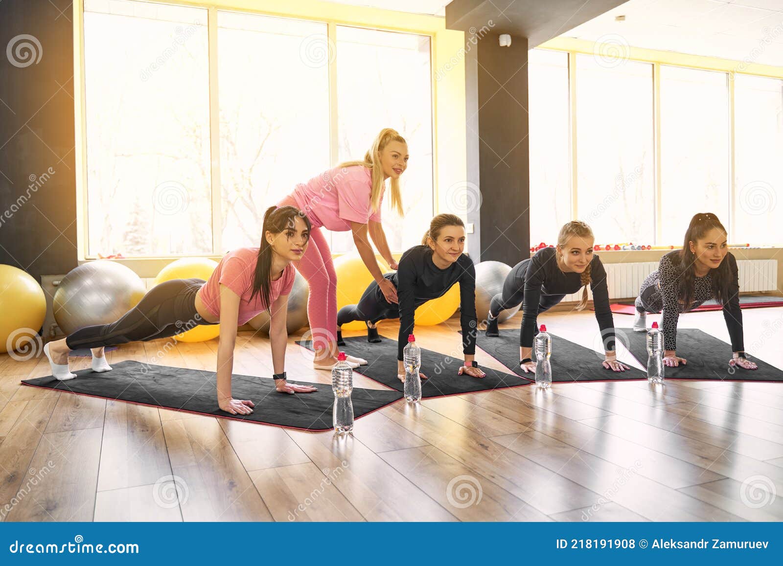Group of Young Women Doing Plank Together in Gym Stock Photo - Image of ...
