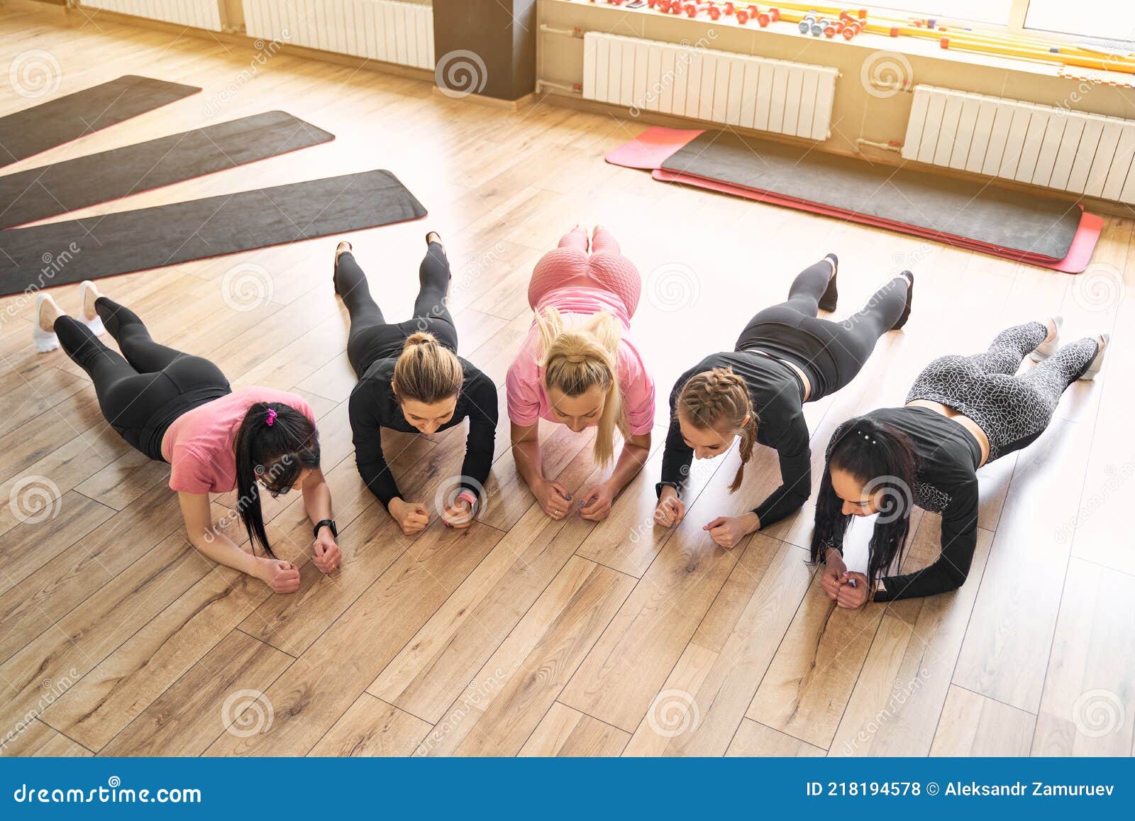Group of Young Women Doing Plank Together in Gym Stock Photo - Image of ...