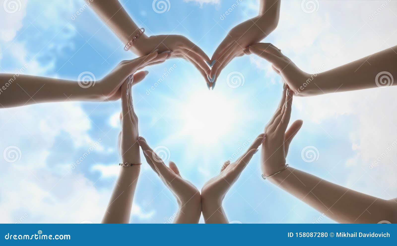 A Group of Youth Makes a Heart Shape Out of Their Hands. Stock Photo ...