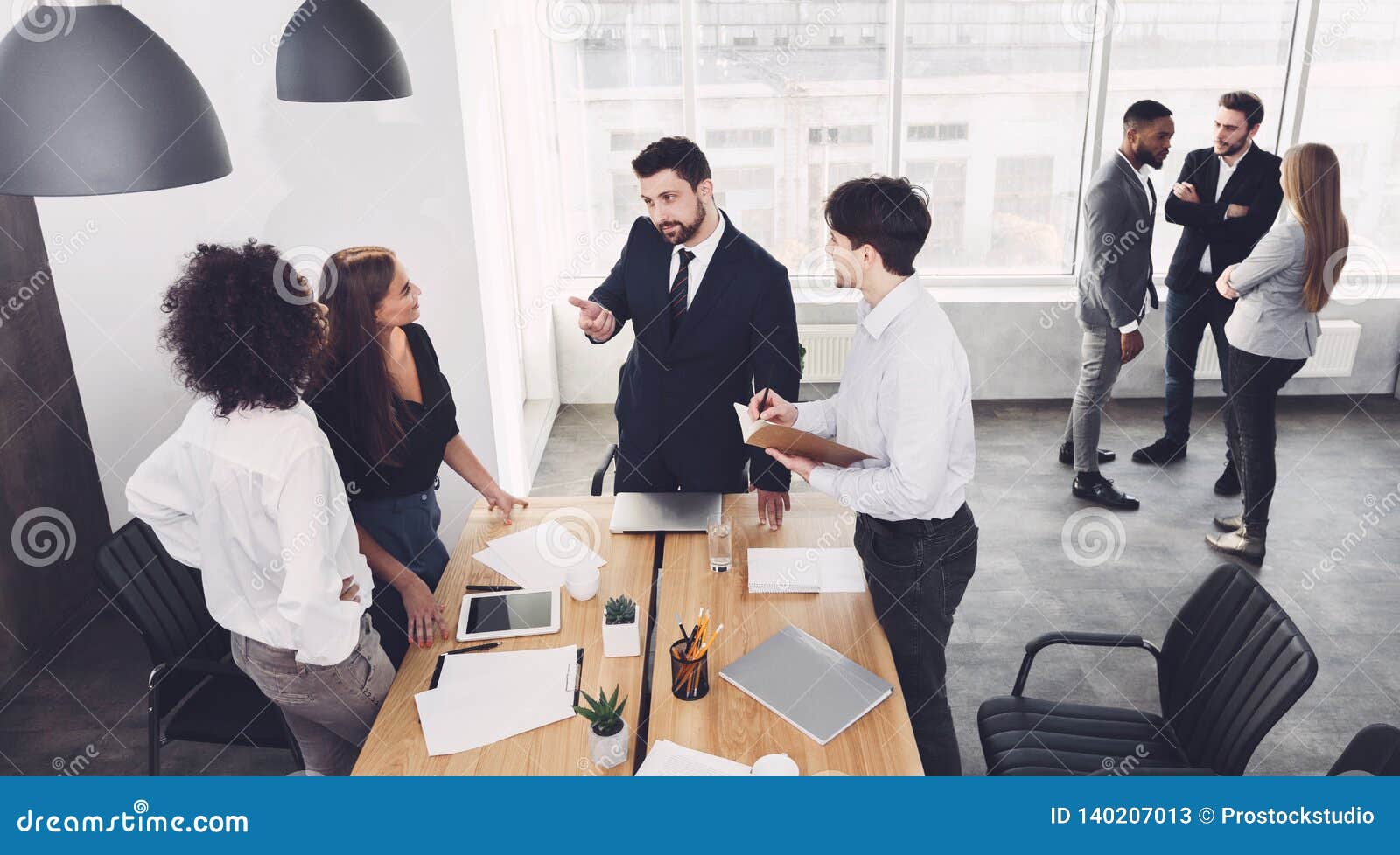 Groups of Young Business People Communicating in Office Stock Image ...