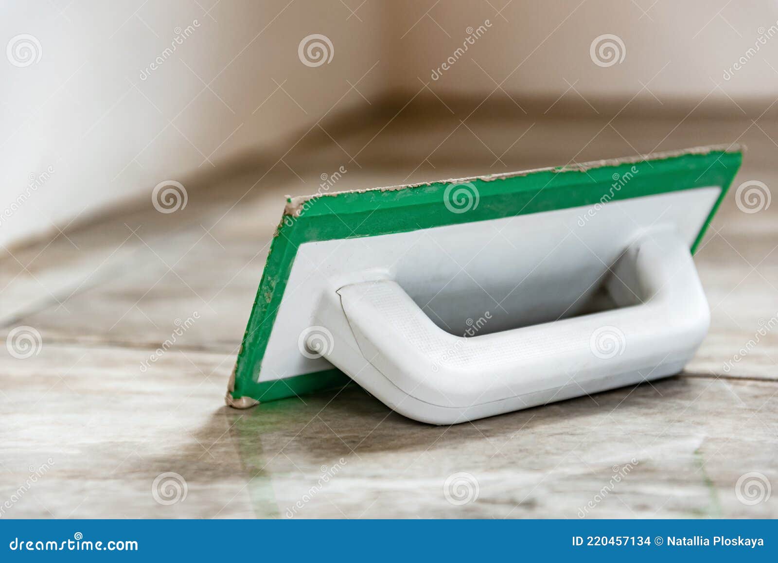 Grouting Ceramic Tiles. Tilers Filling the Space between Tiles Using a ...