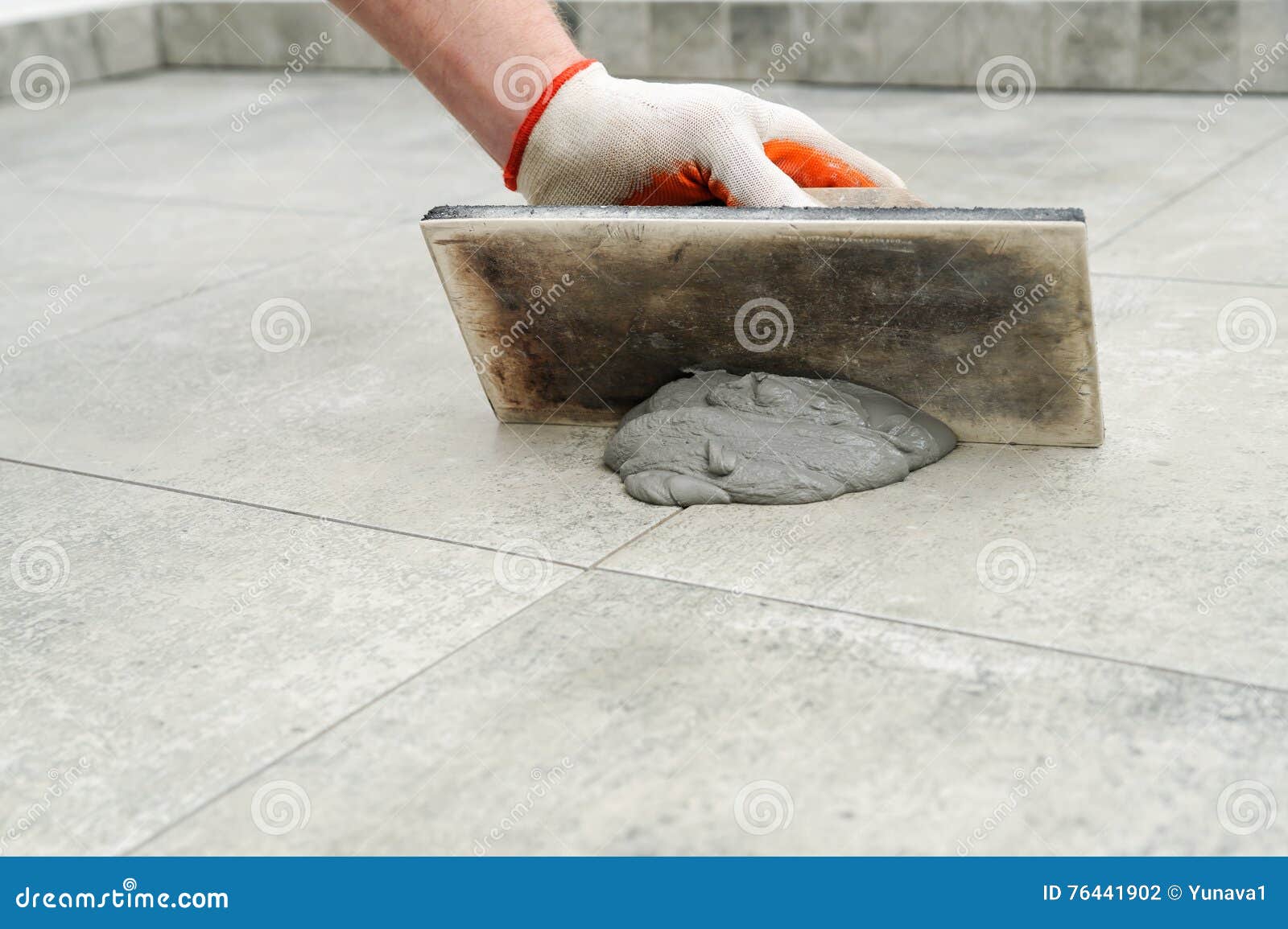 Grouting ceramic tiles. stock photo. Image of tiler, renovation - 76441902
