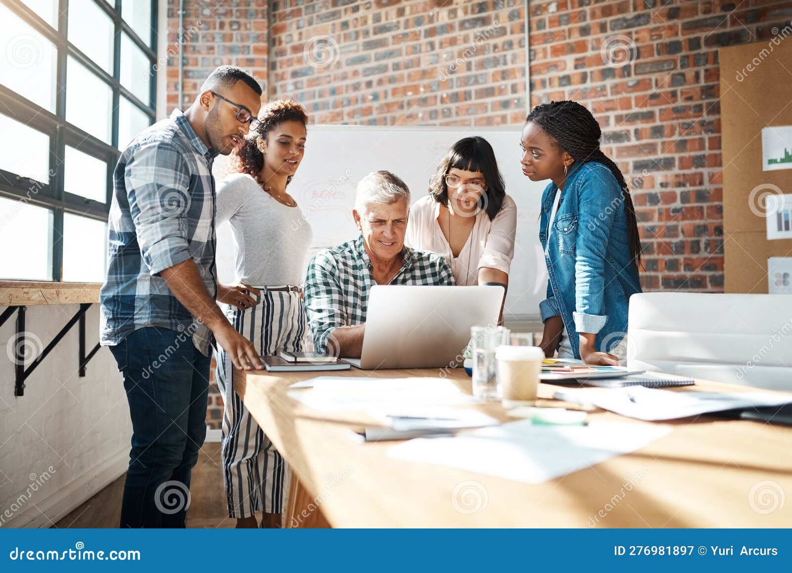 Growing Businesses Thrive on Teamwork. a Group of Colleagues Using a ...