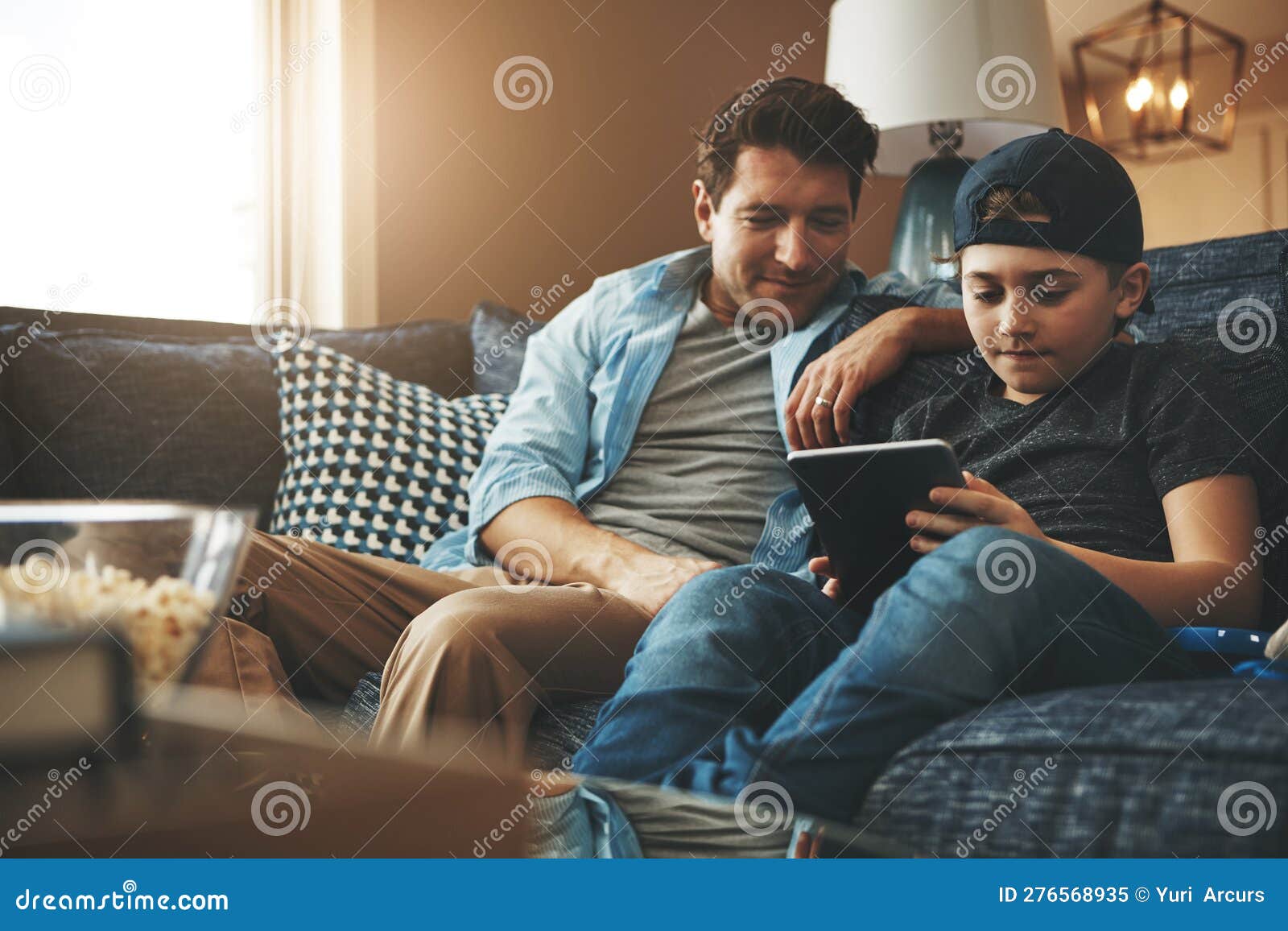 Growing Up Technology Literate. a Father and His Son Using a Digital ...