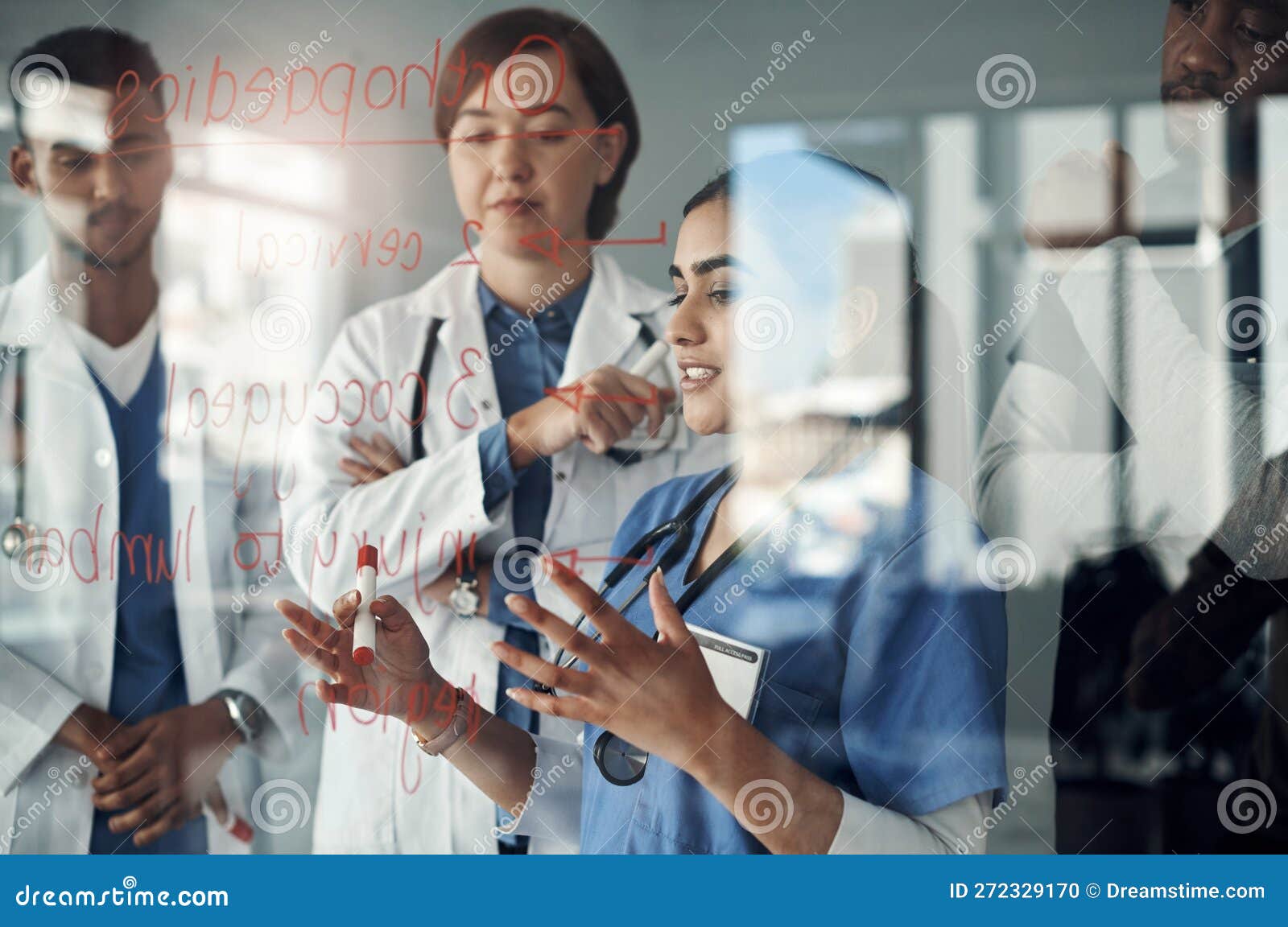 Growth Comes with Asking Questions. Shot a Group of Doctors Discussing ...