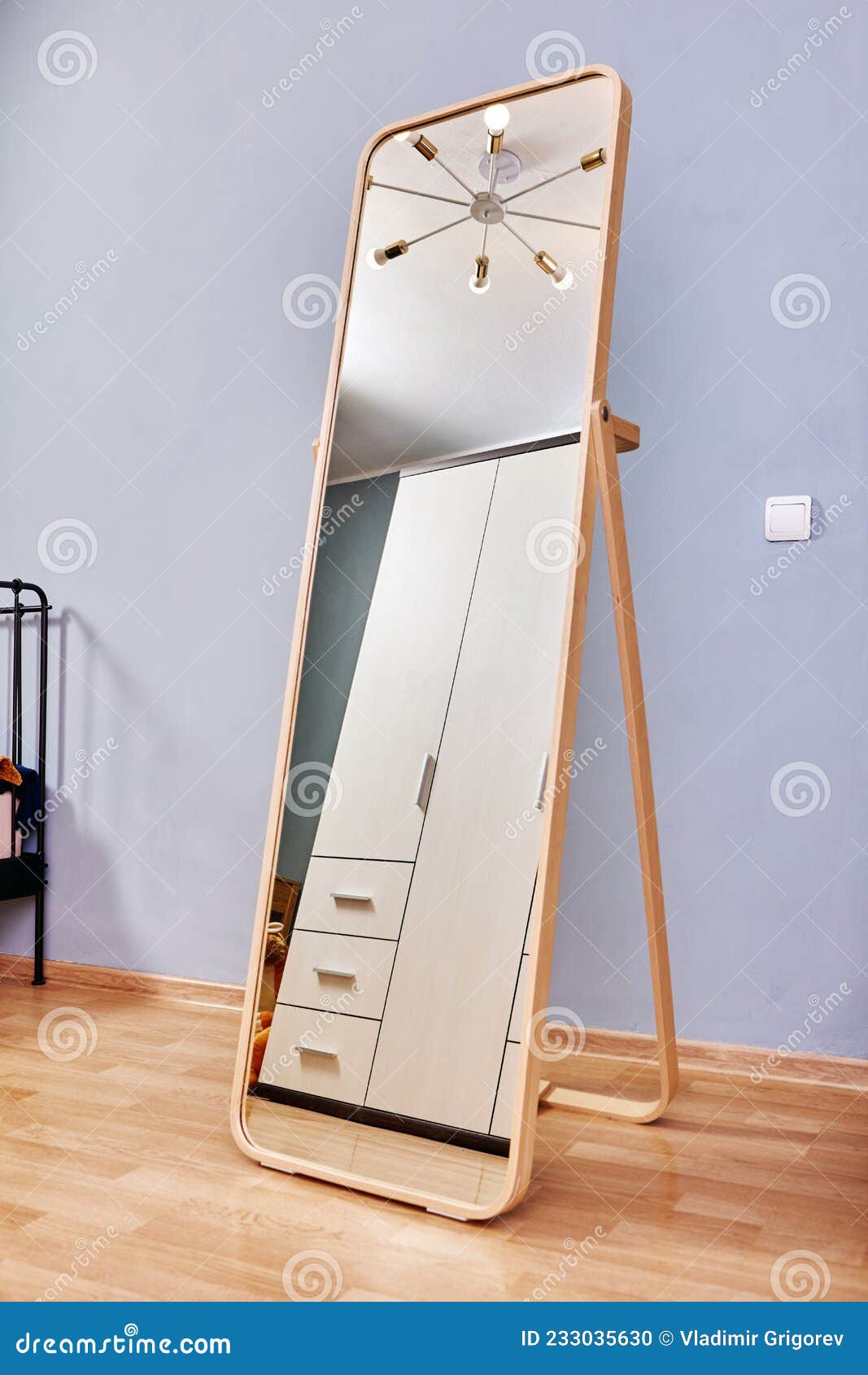 Growth Mirror Stands in Bedroom on Laminate Floor. Stock Photo - Image ...