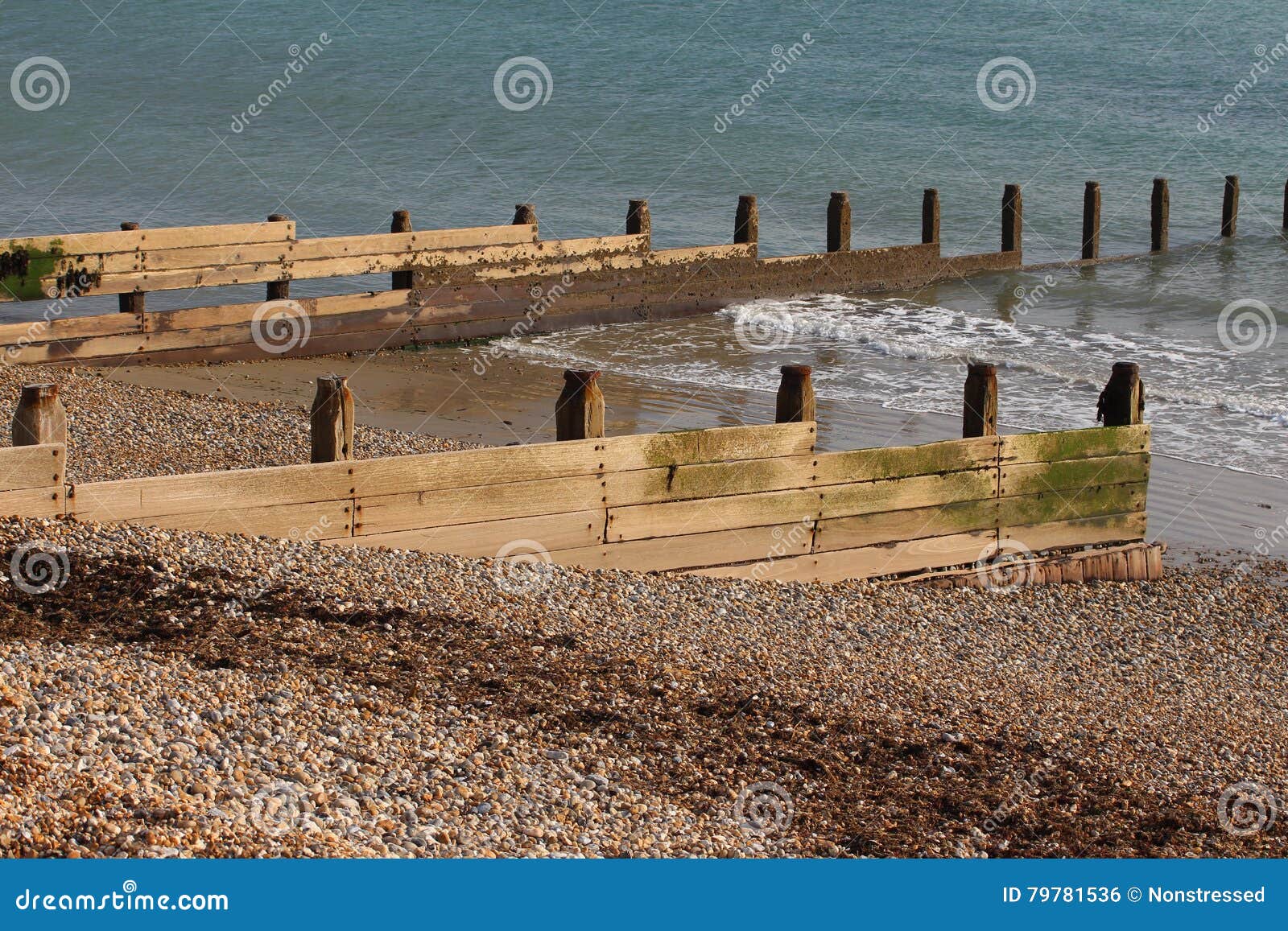 Groynes Holding Back the Erosion of a Seashore Stock Photo - Image of ...