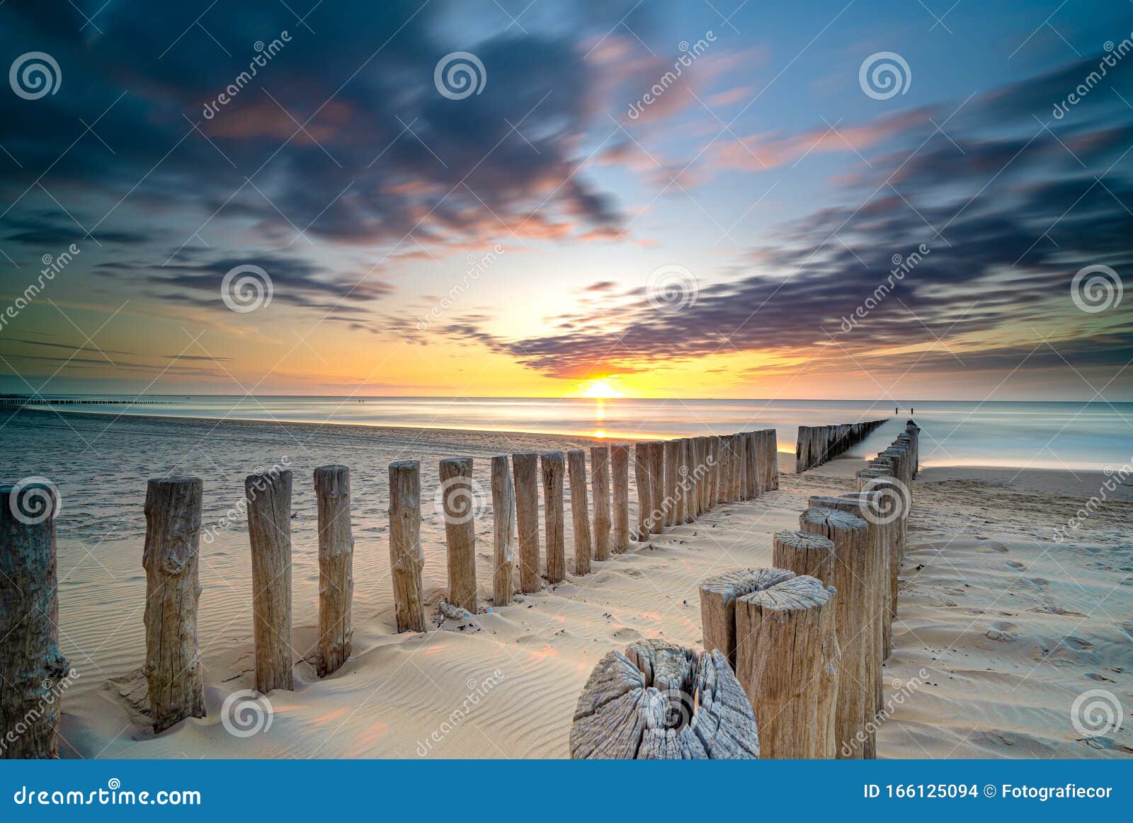 Groynes and Wave Breakers in a Smooth Sea Just before Sunset at a Dutch ...