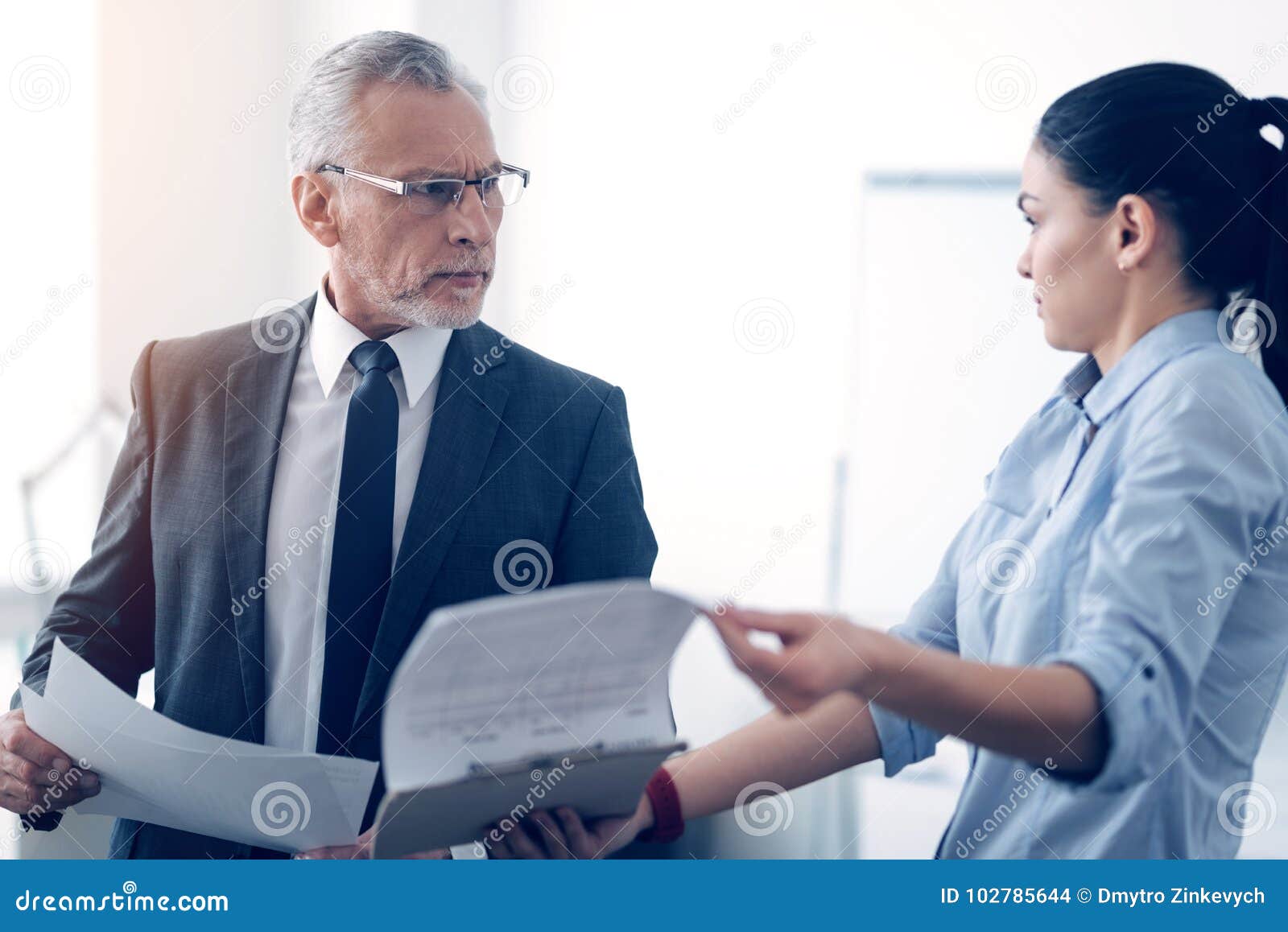 Grumpy Chief and His Female Office Worker Arguing Over Documents Stock ...