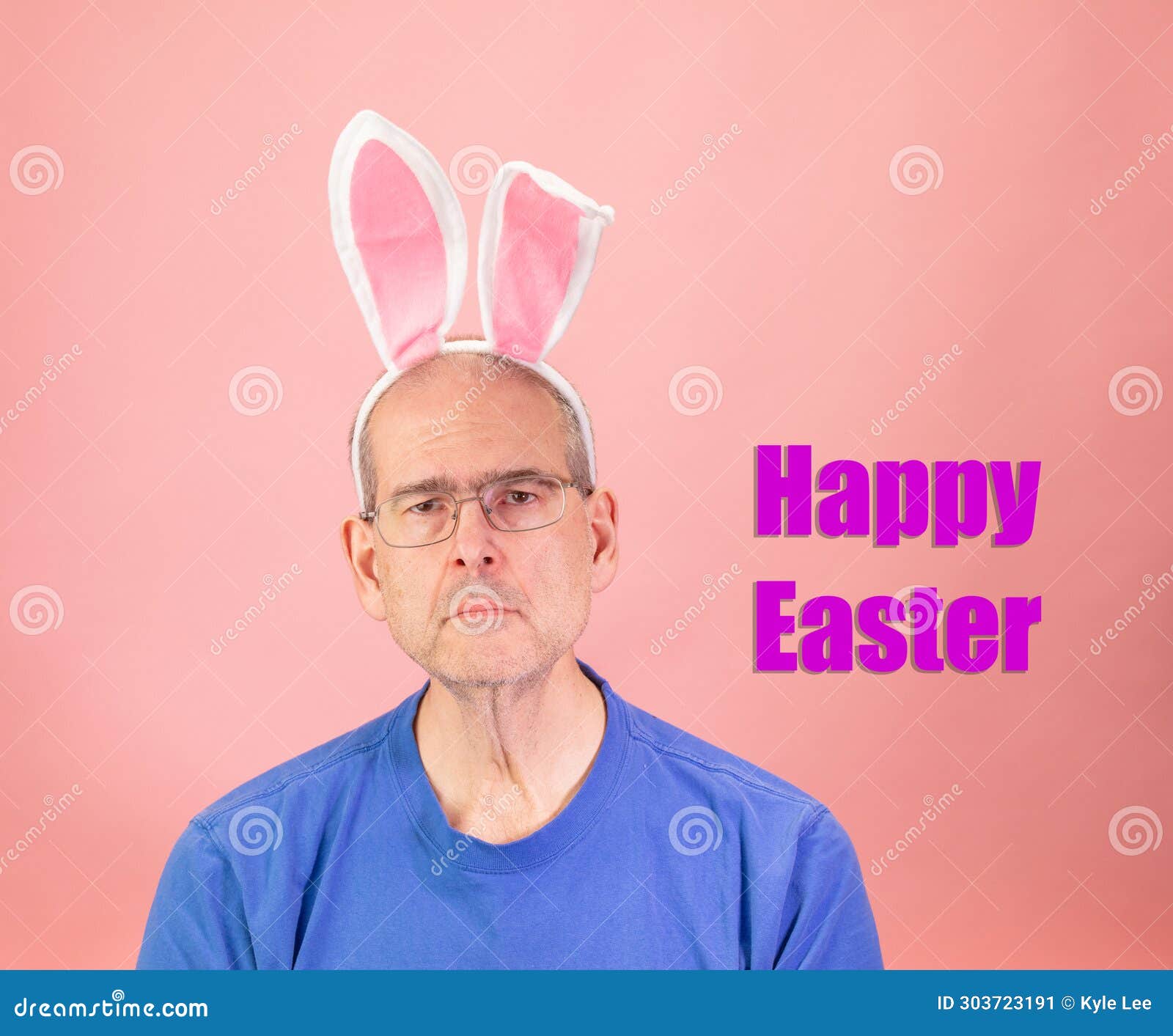 Grumpy Old Man with Easter Bunny Ears Looks Deadpan at the Camera Stock ...