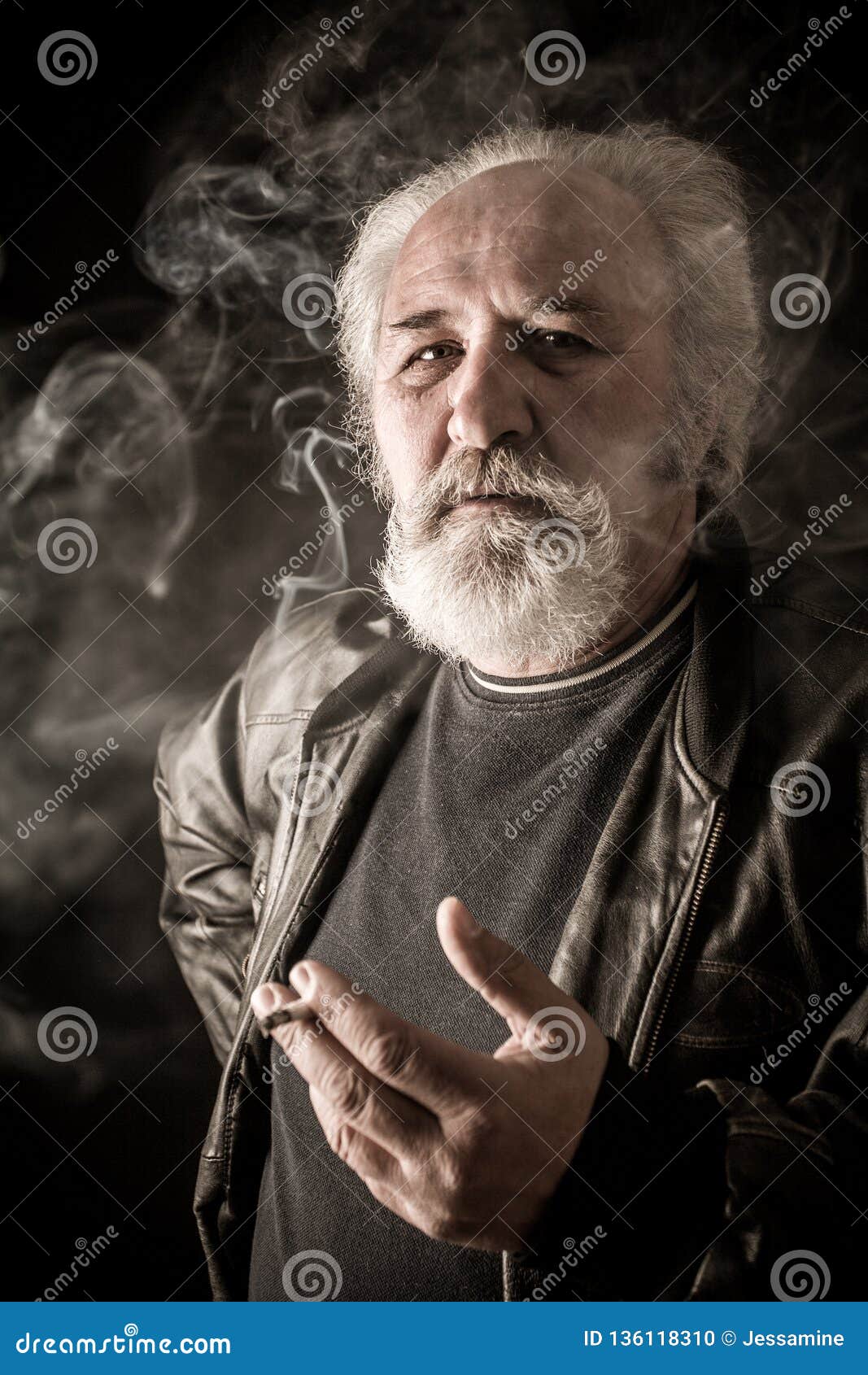 Grumpy senior man smoking stock photo. Image of person - 136118310
