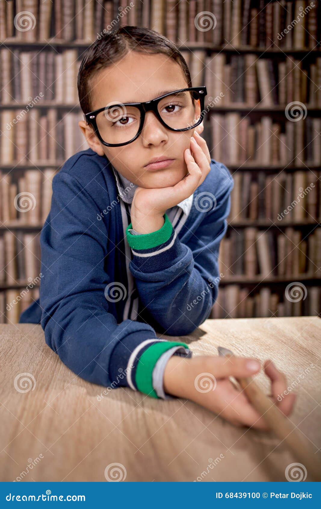 Grumpy Young Boy in Library Stock Photo - Image of knowledge, schoolboy ...