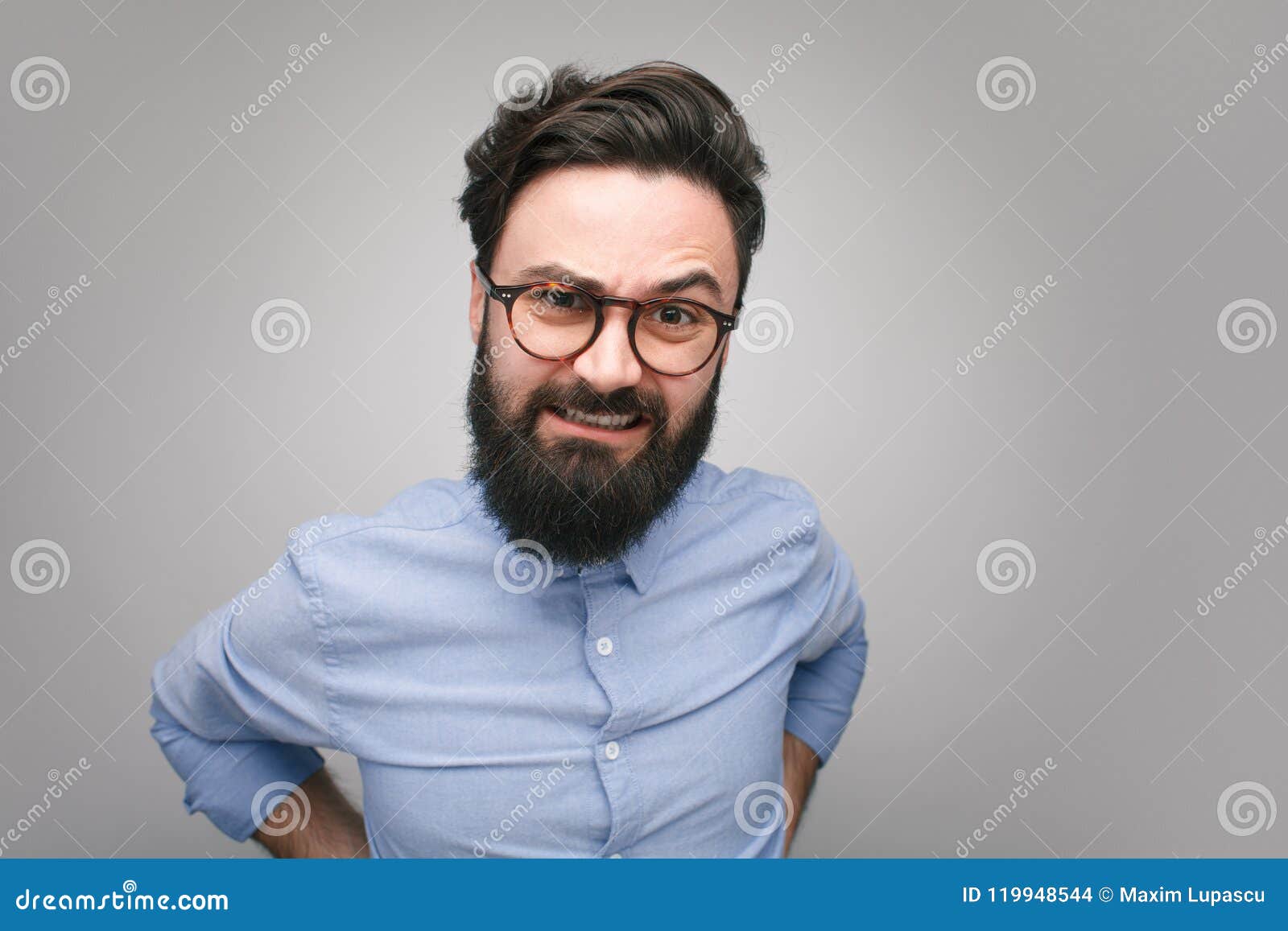Grumpy Young Man in Glasses Stock Photo - Image of dissatisfied ...