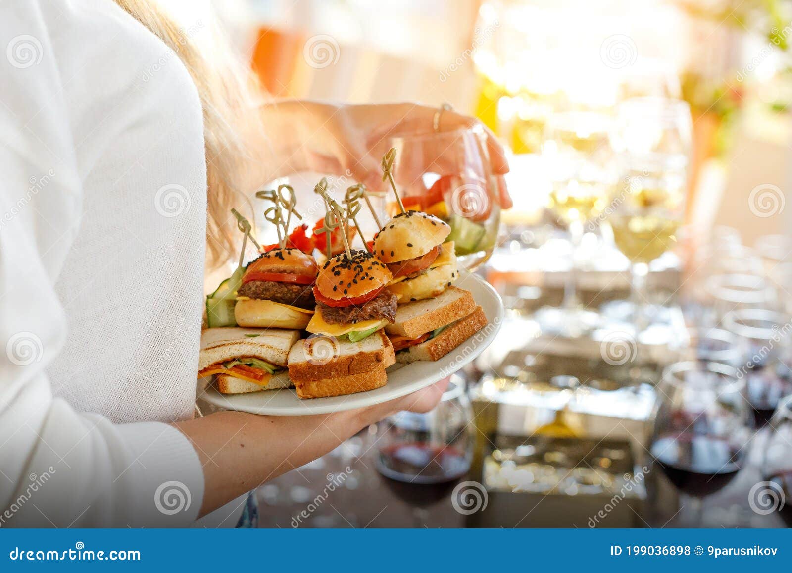 Guest Holding a Plate of Different Snacks at the Event Stock Photo ...