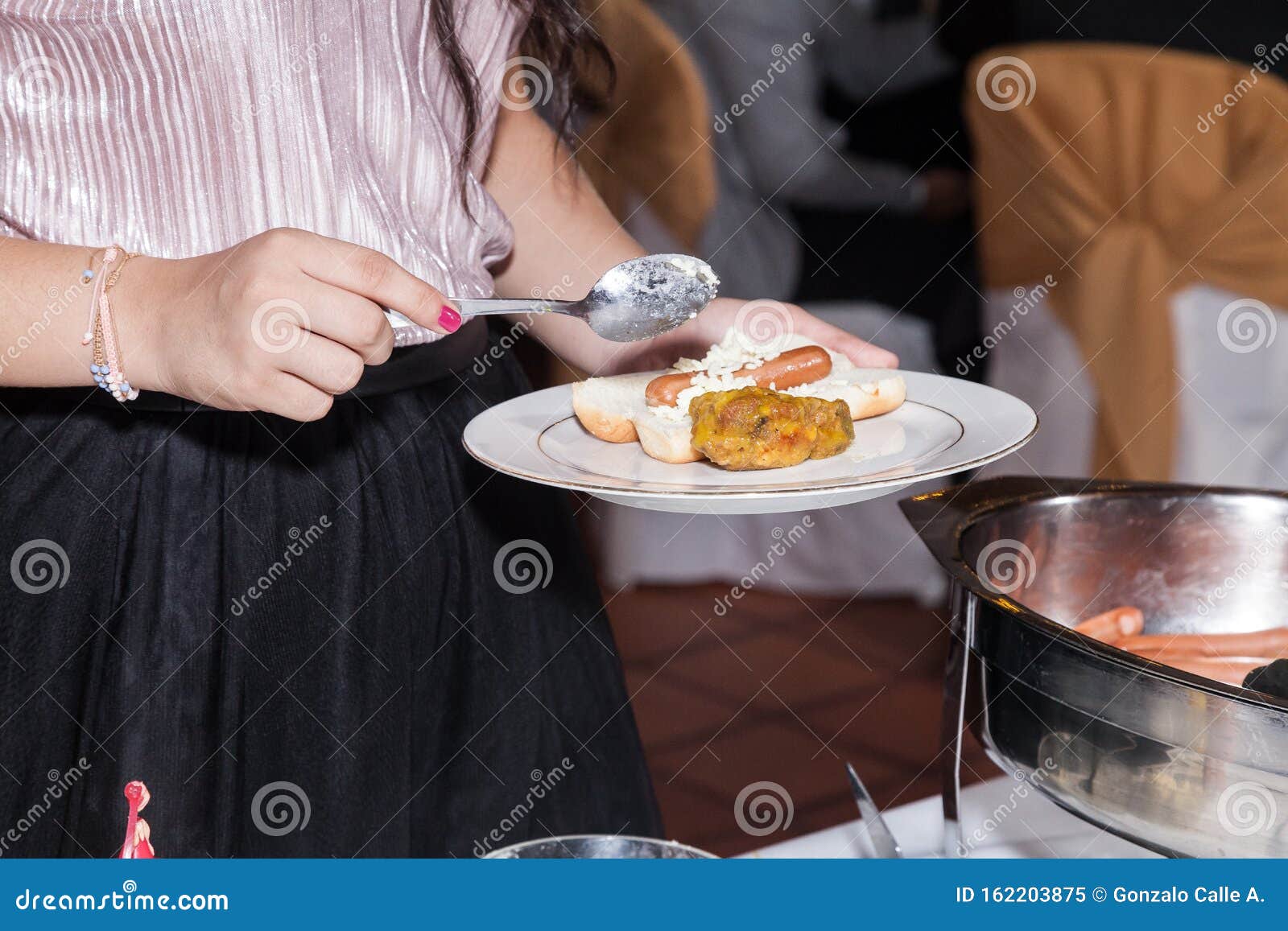 Guest at the Reception with a Dish Served after Going through the ...
