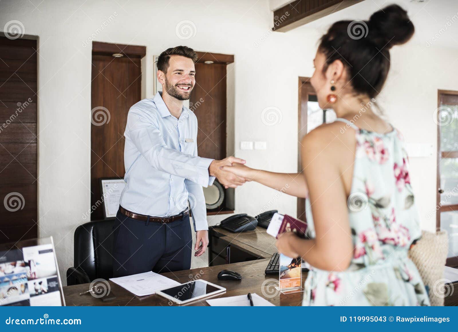 Guests Checking in To a Hotel Stock Image - Image of shaking, greeting ...