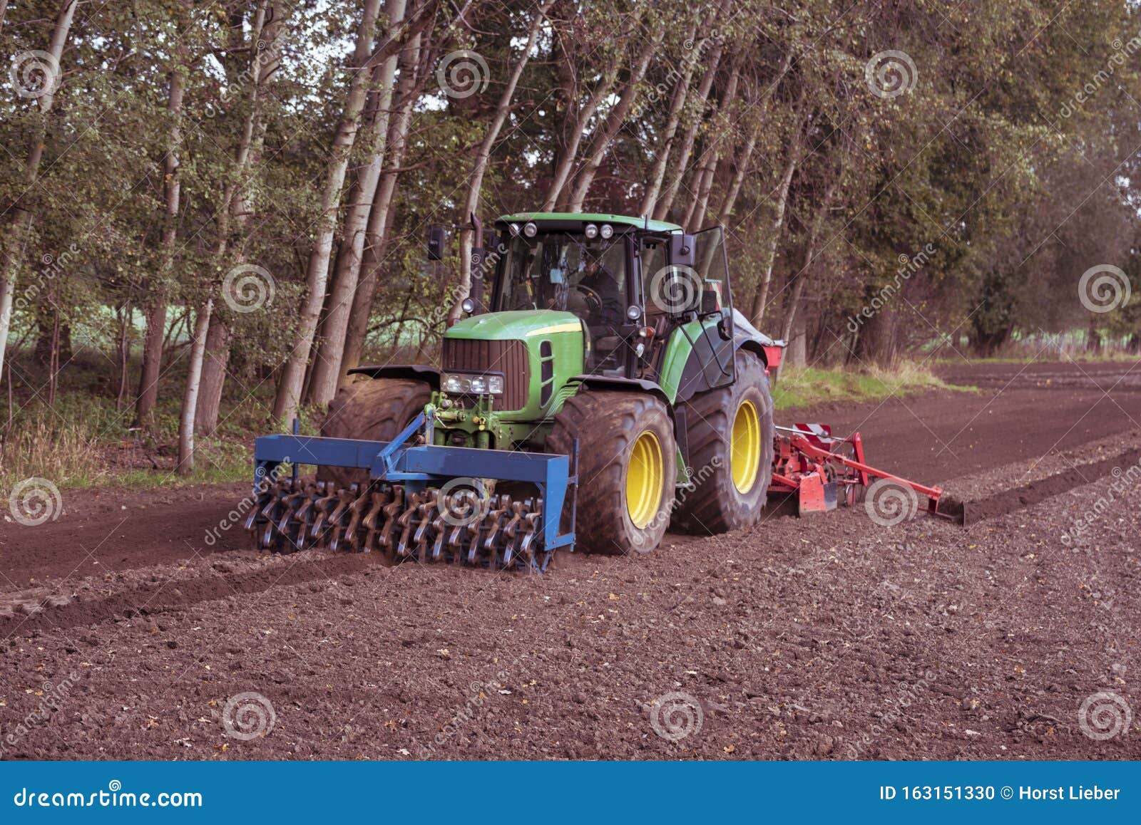 Tractor with Seed Drill and Front Packer Which Compacts the Soil ...