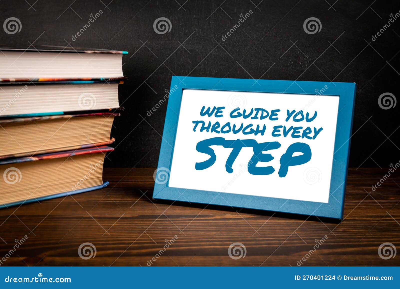 We Guide You through Every Step. Text in a Picture Frame on a Wooden ...