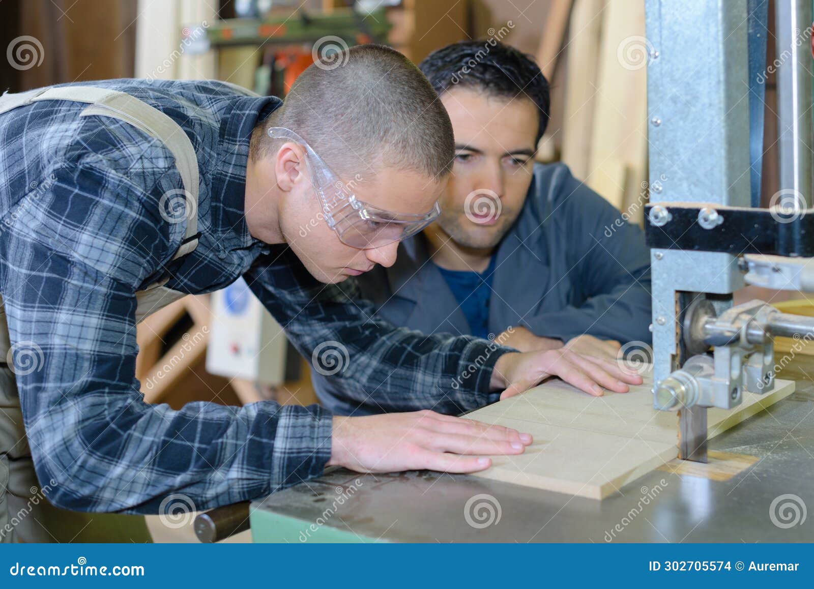 He guides him in cutting stock photo. Image of carpenter - 302705574