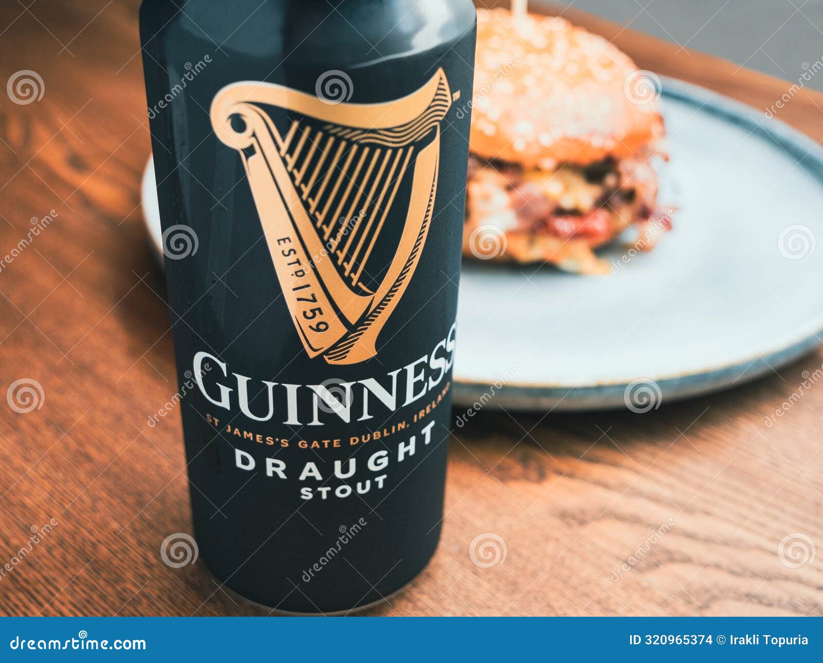 Guinness Beer and Burger on Wooden Table Editorial Stock Image - Image ...