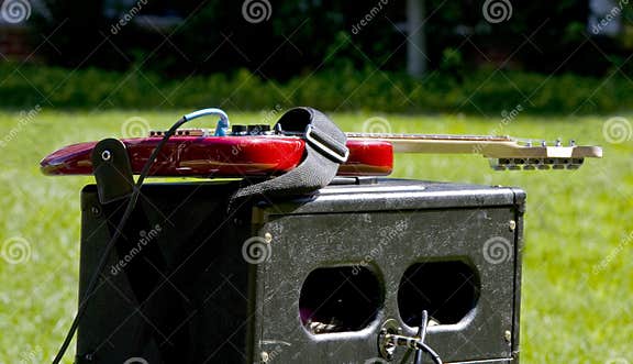 Guitar on amp in grass stock image. Image of leisure - 16085273