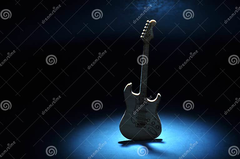 Guitar on a Dark Stage with Spotlight Stock Image - Image of lead ...