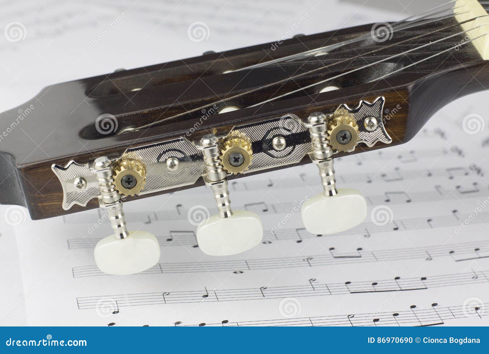 Guitar Head Closeup on Music Notes Stock Photo - Image of note, classic ...