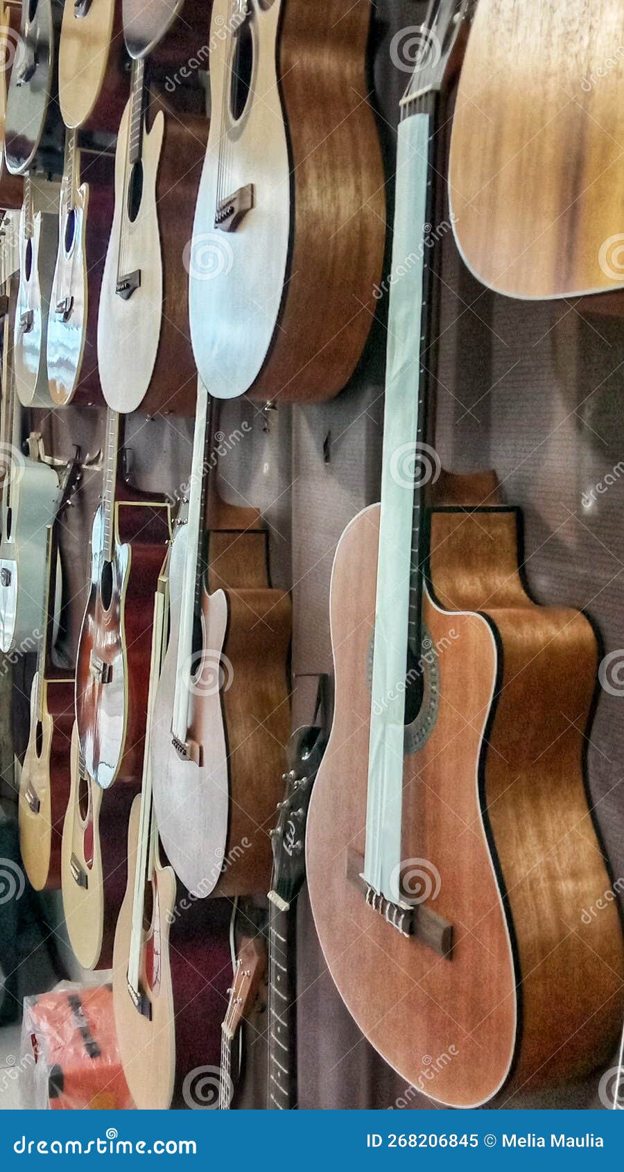 Guitar Musical Instrument Hanging on the Wall with Various Colors Stock ...